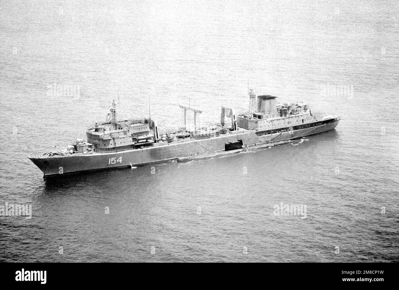 A port view of a Soviet Tango class patrol submarine tied up alongside ...