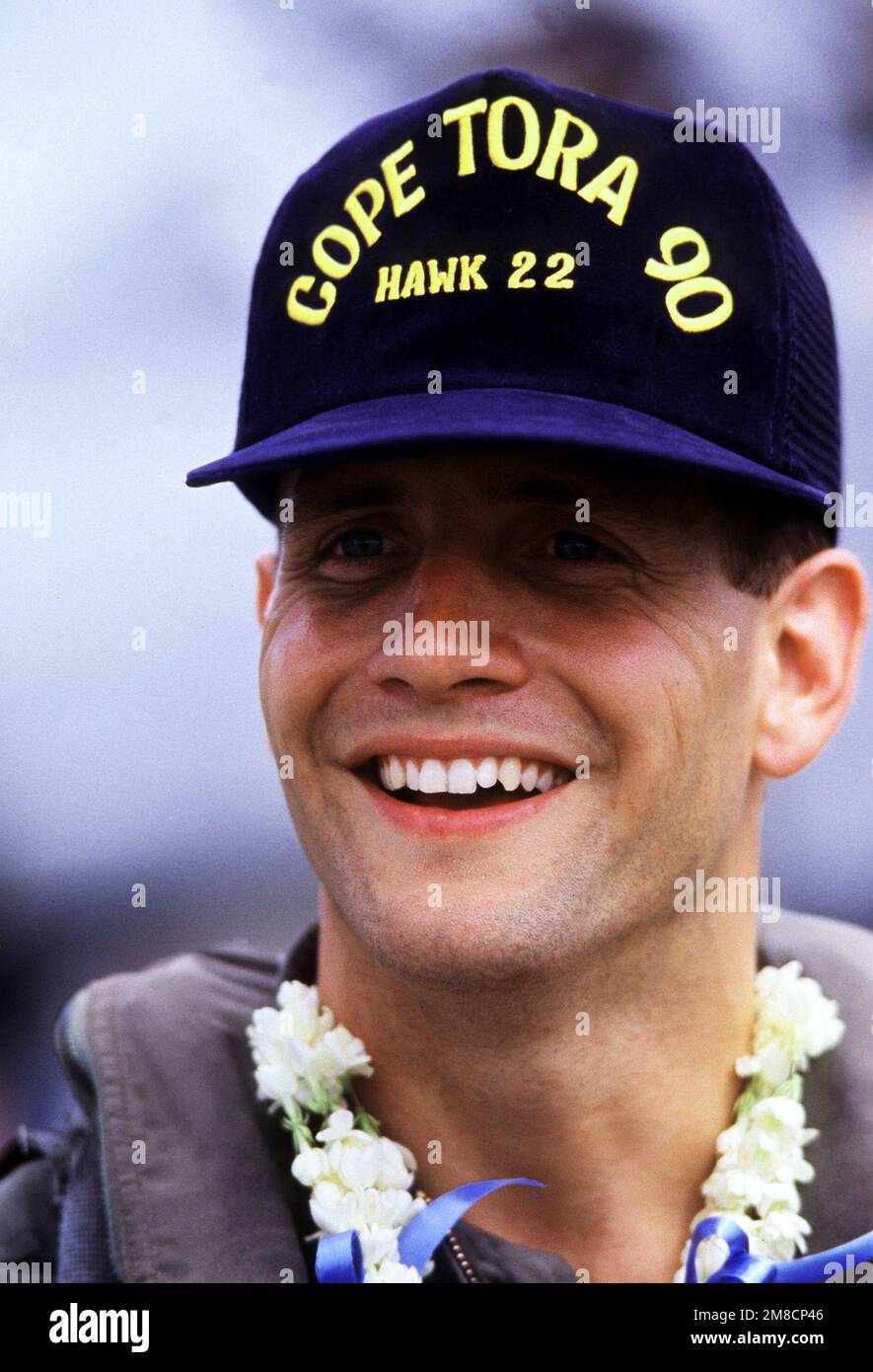 A flight crewman from the 3rd Tactical Fighter Wing smiles after ...