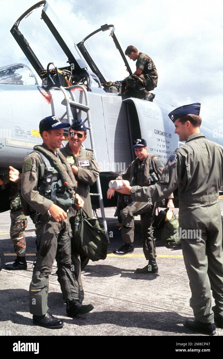 A fellow squadron member arrives with beers for the pilot and radar ...