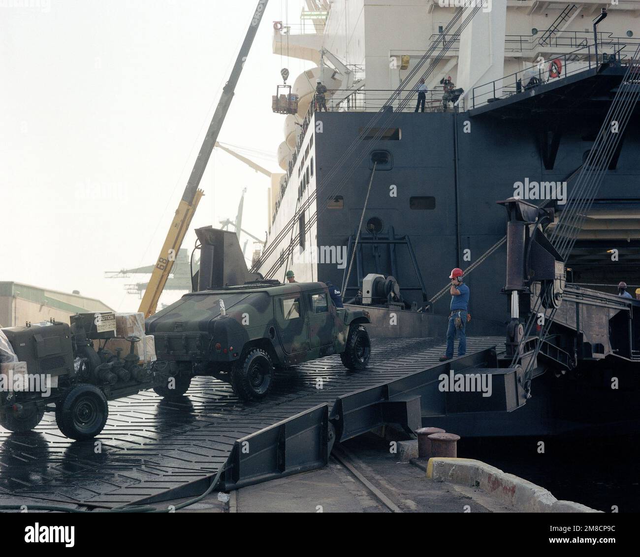 An M998 High-Mobility Multipurpose Wheeled Vehicle (HMMWV) pulls a ...