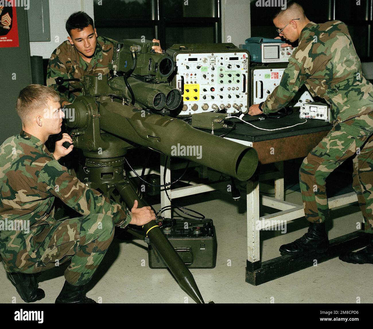 Three Marines of School Company diagnose a problem with the tracker of ...
