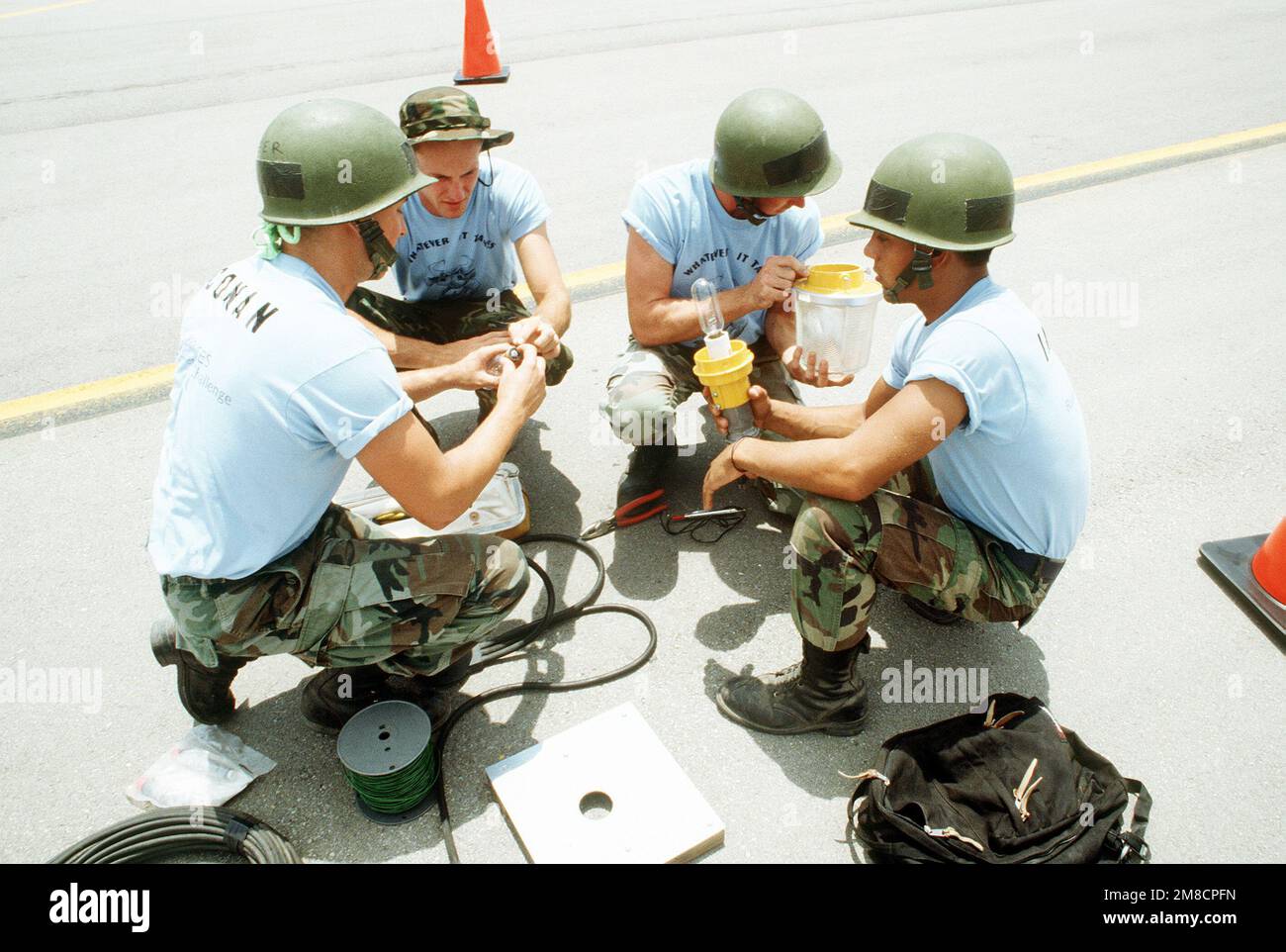 Members of the 833rd Civil Engineering Squadron inspect equipment prior ...