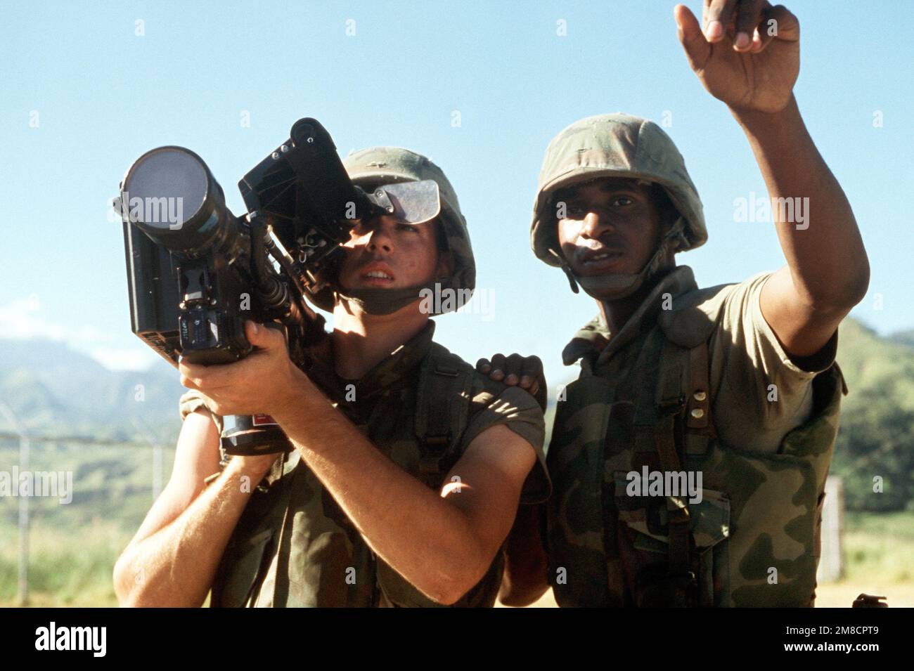 U.S. Marines practice sighting on incoming aircraft with a Stinger ...
