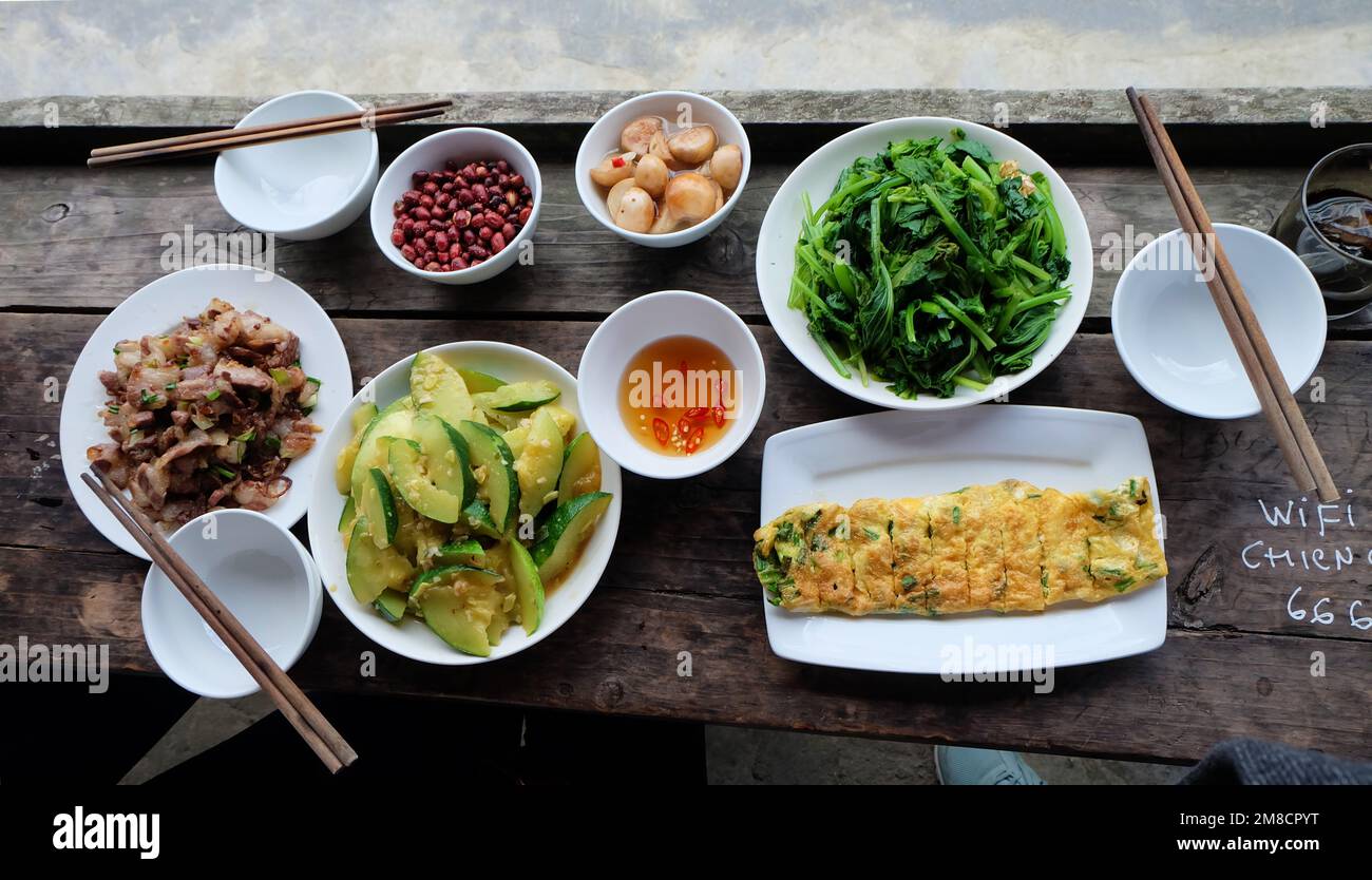 Simple local meal prepared by restaurant owner in Sapa Valley Stock ...