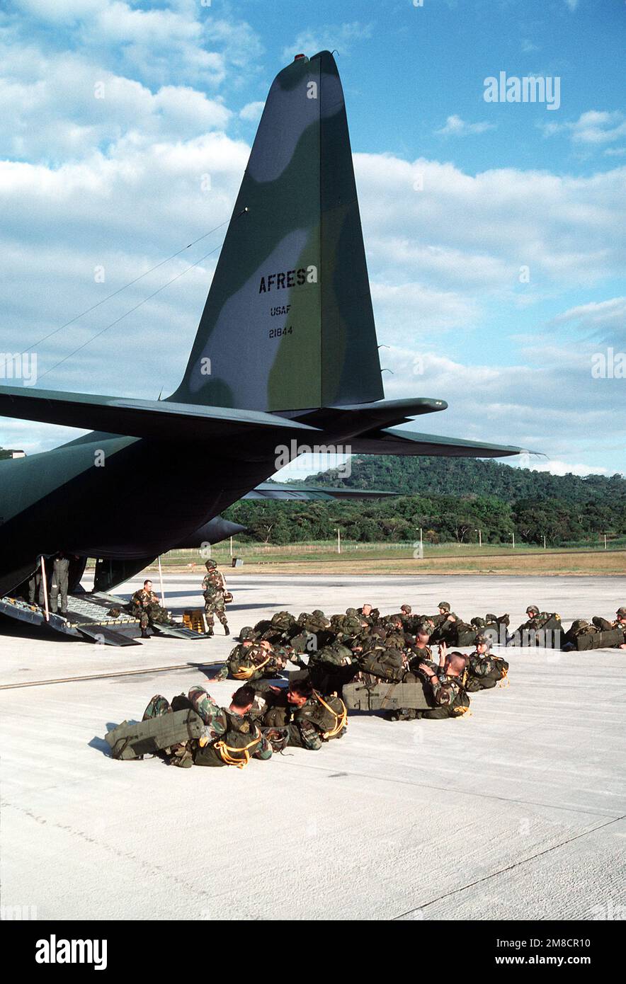 Soldiers of 1ST Battalion, 509th Infantry, relax before boarding a ...