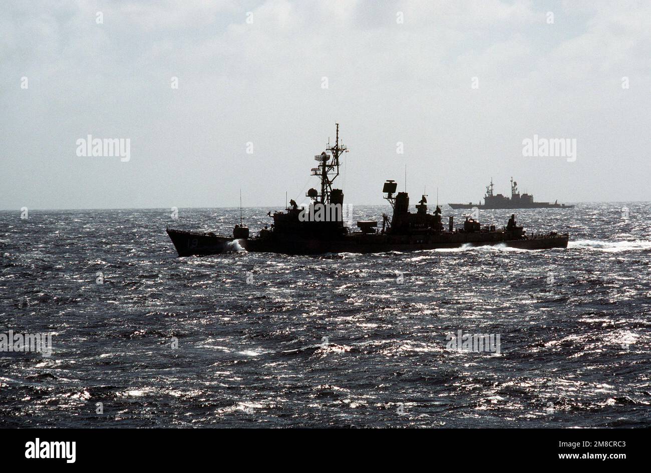 A port beam view of the guided missile destroyer USS TATTNALL (DDG-19 ...