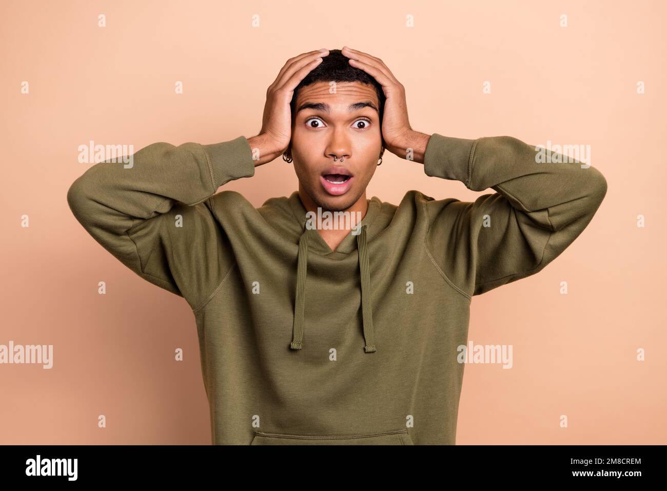 Photo of young hipster nervous guy touch hands head stressed panic ...