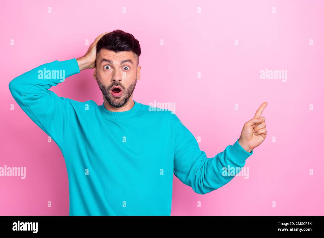 Photo of young funny surprised confused guy decision touch head direct ...