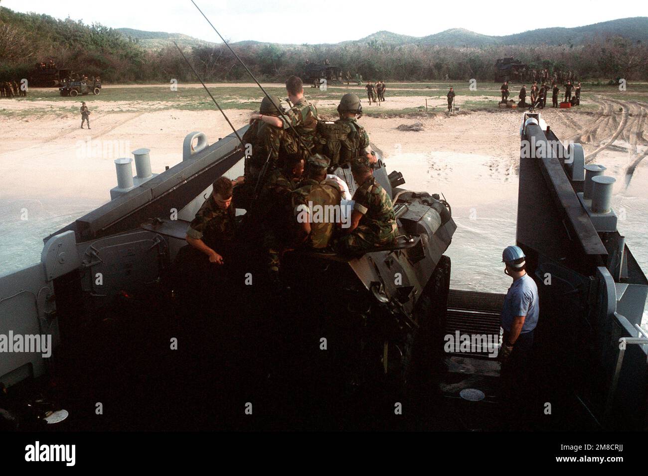 Marines in a light assault vehicle (LAV-25) are offloaded from a ...