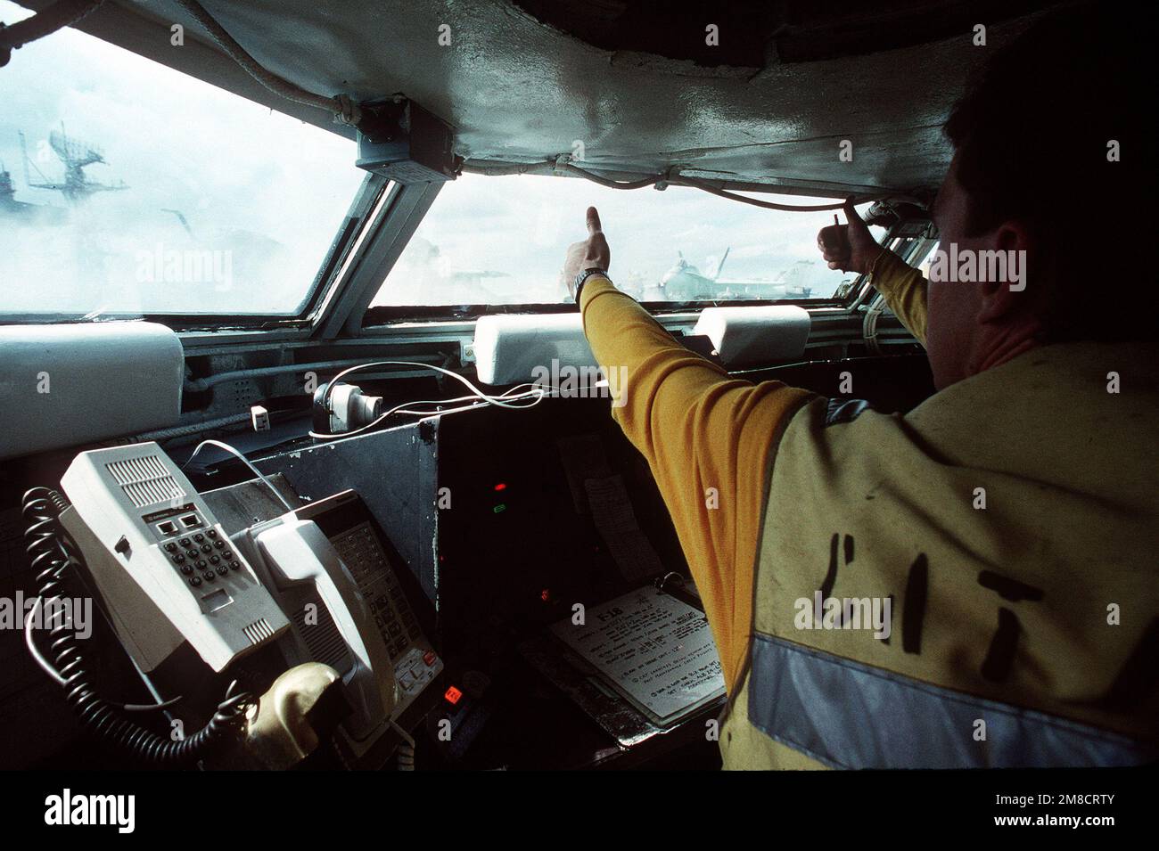 Catapult and arresting gear officers in the waist catapult control ...