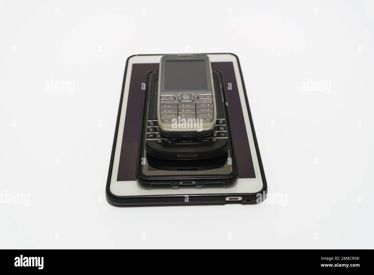 mobile gsm devices new and old size comparison Stock Photo - Alamy