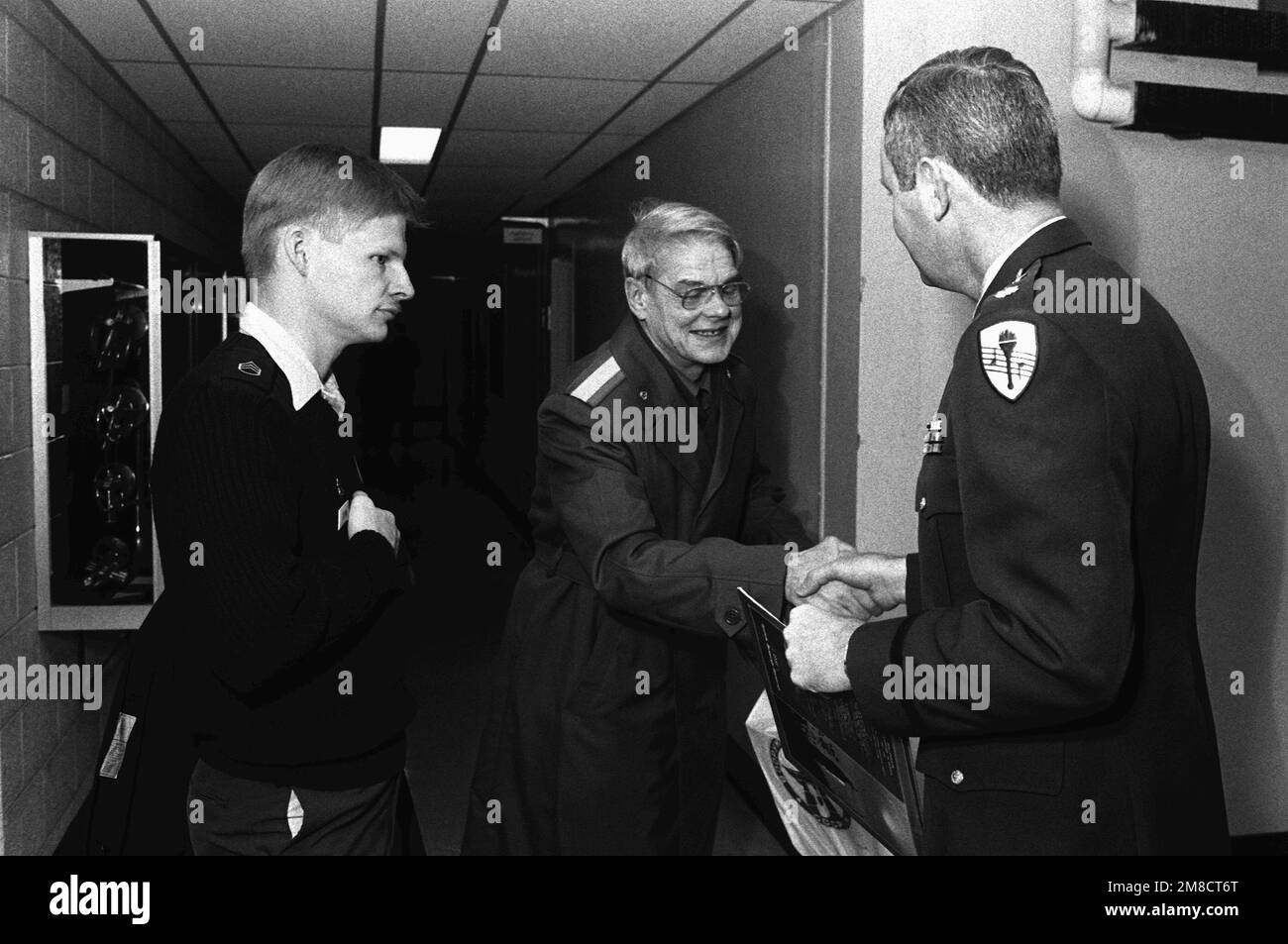 A U.S. Army musician greets a member of a visiting Soviet military band ...