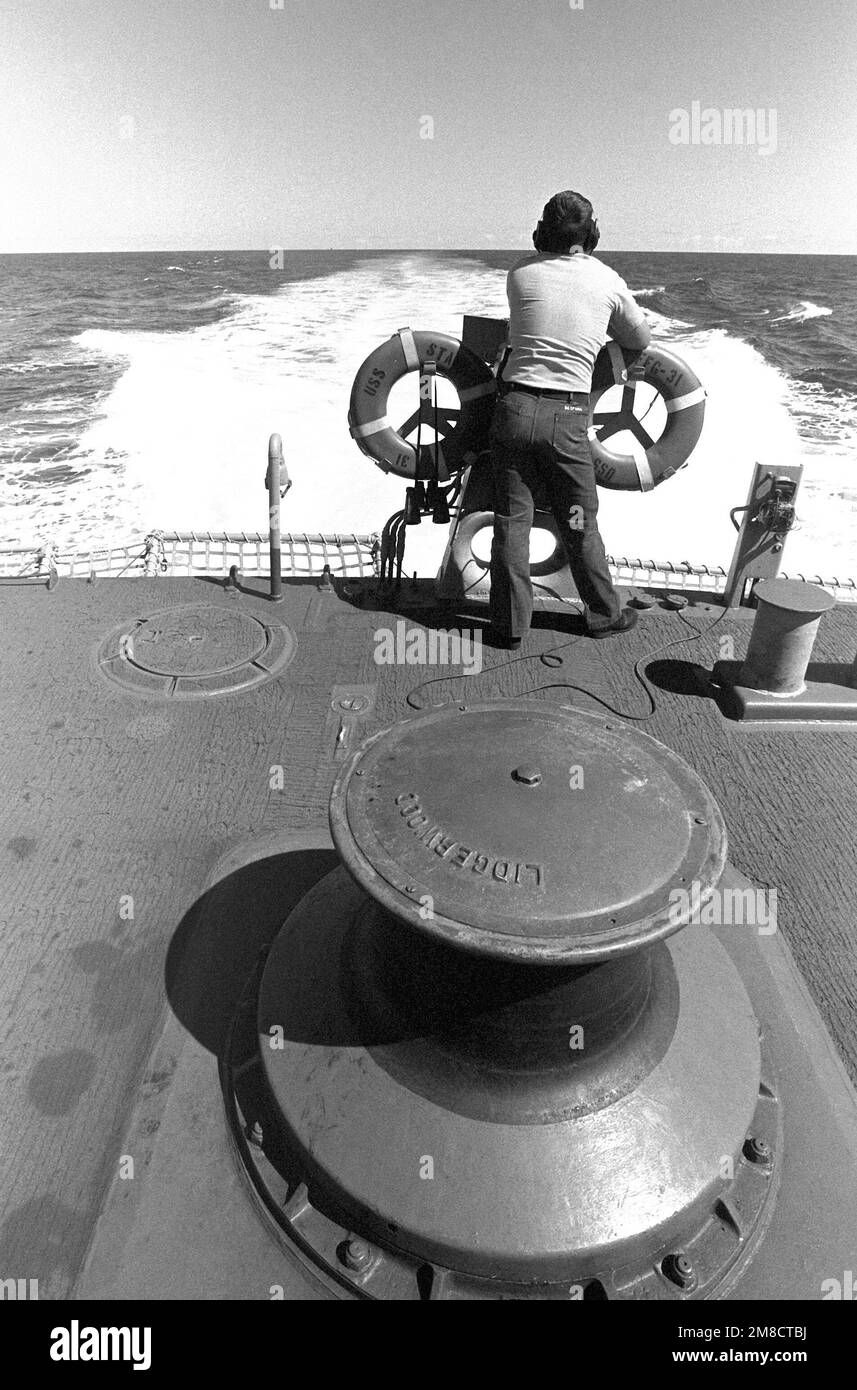 SN Daniel Bezpalko stands watch on the fantail of the guided missile ...
