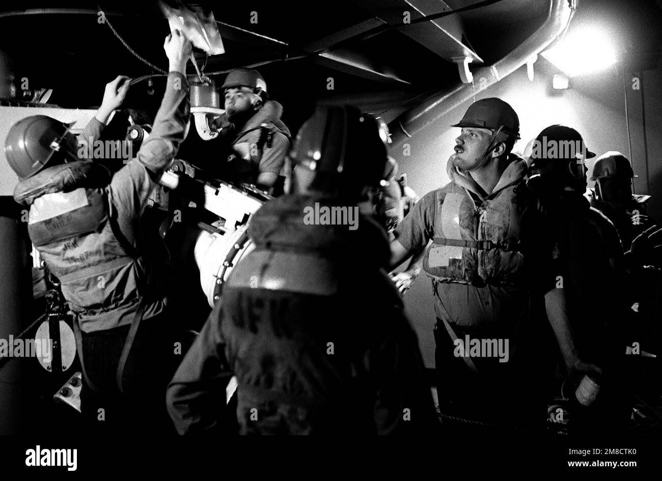 Sailors manning an underway replenishment station aboard the aircraft ...