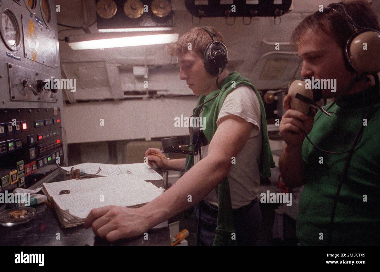 AIRMAN Steve McDiffit, left, and Aviation Boatswain's Mate 2nd Class ...