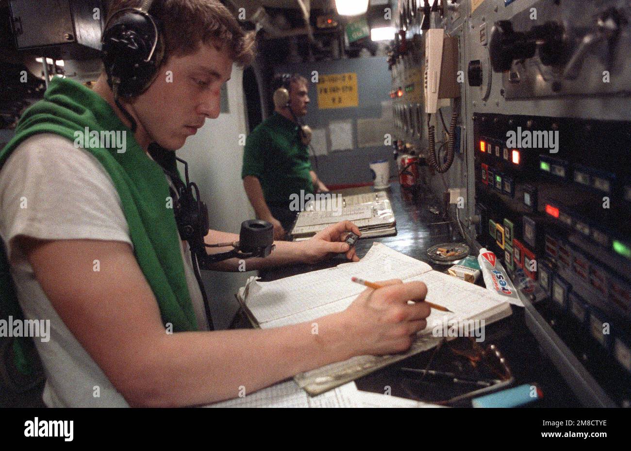 AIRMAN Steve McDiffit records data from the steam charging panel on the ...