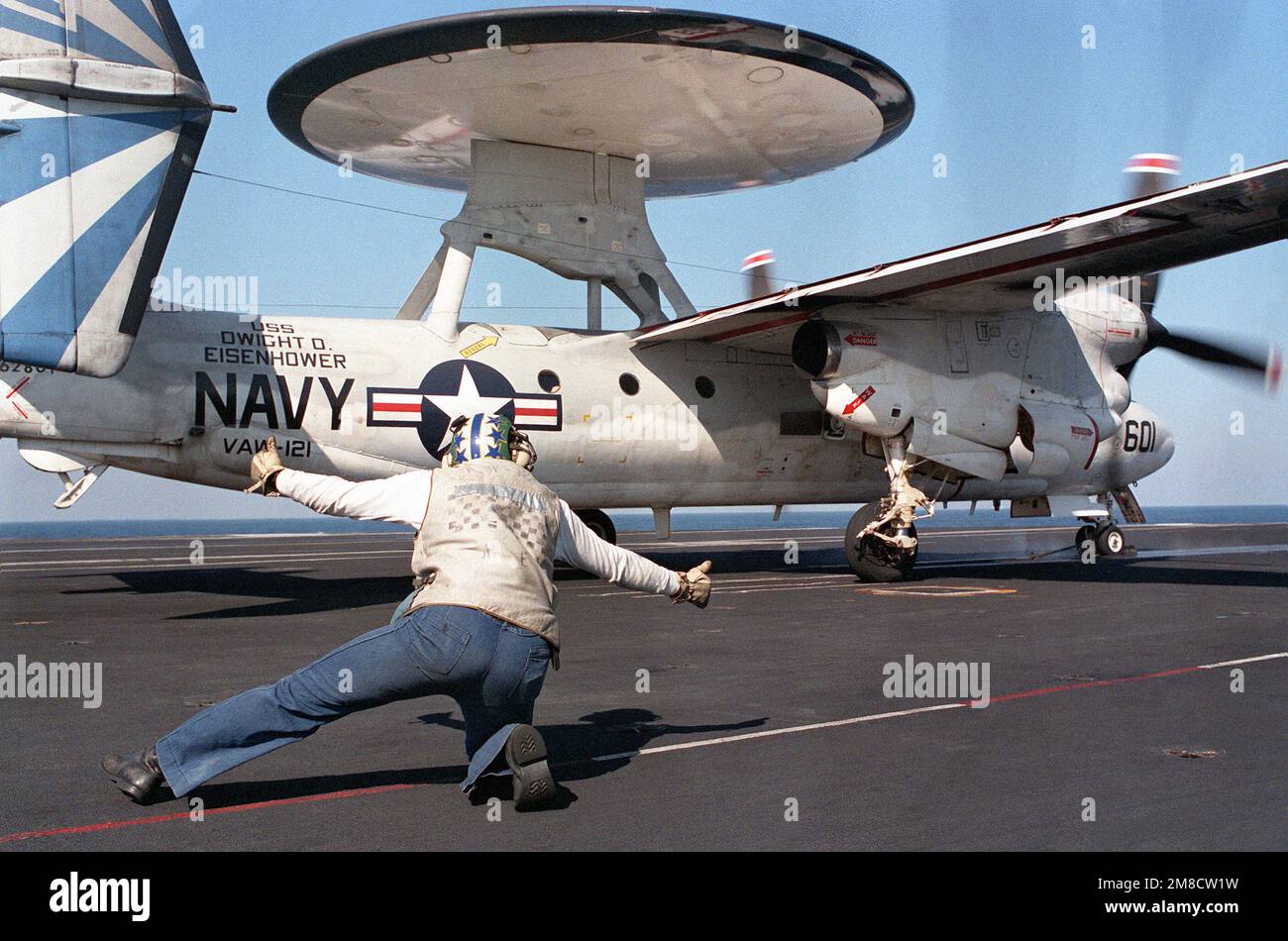 A safety officer signals that an Airborne Early Warning Squadron 121 ...