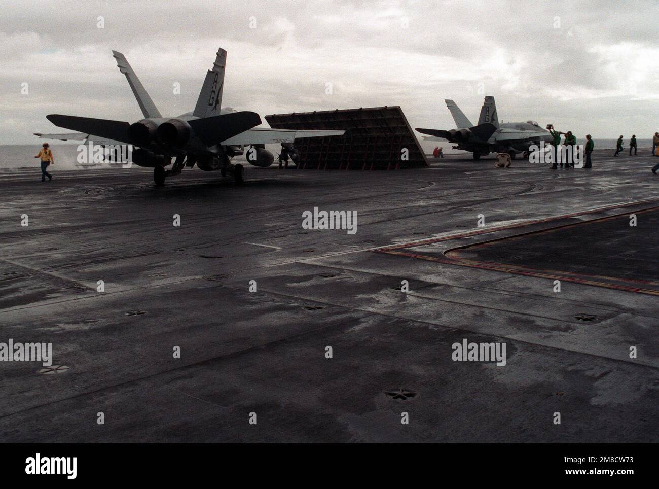 One Strike Fighter Squadron 136 (VFA-136) F/A-18A Hornet aircraft waits ...