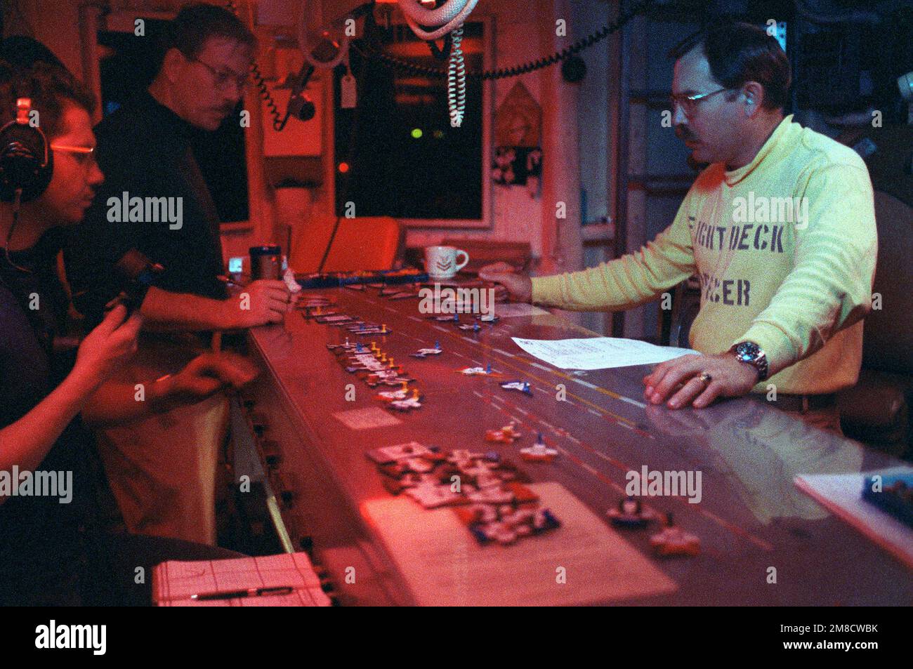 The flight deck officer and his assistants work out an aircraft ...