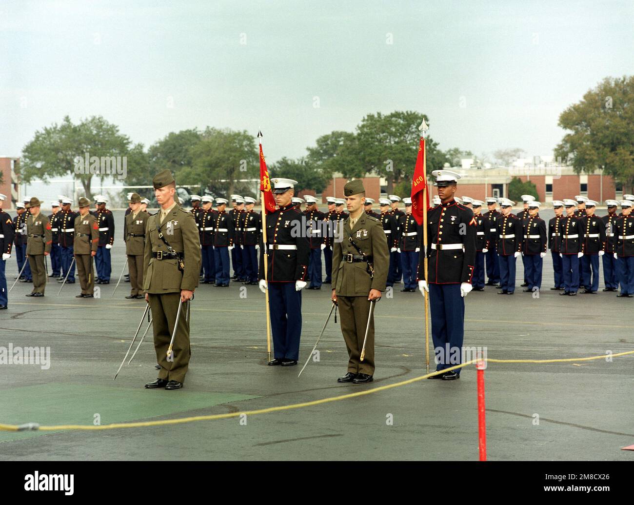 A color guard stands at attention during graduation ceremonies for a ...