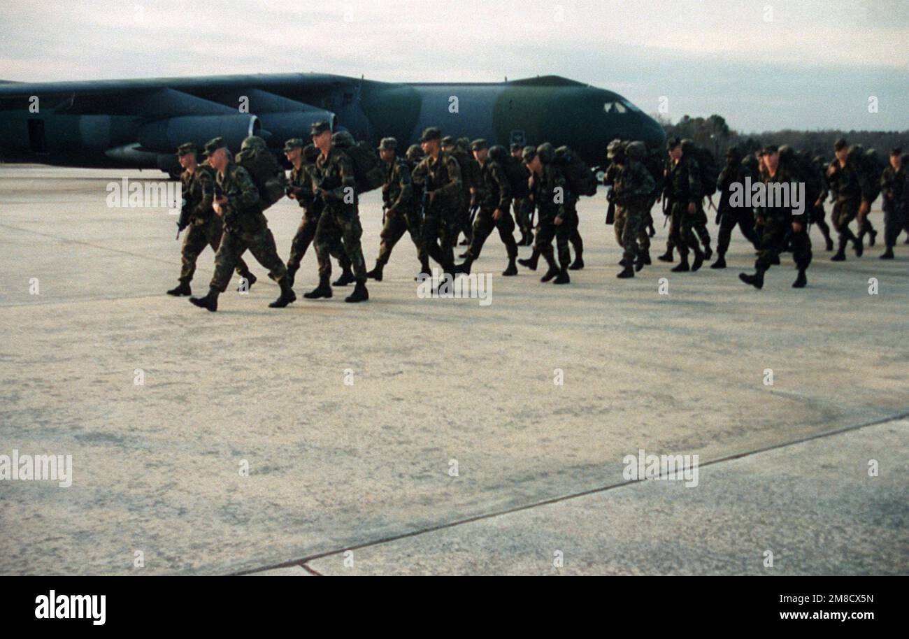 Soldiers of the 1ST Battalion, 75th Ranger Regiment, walk past a 63rd ...