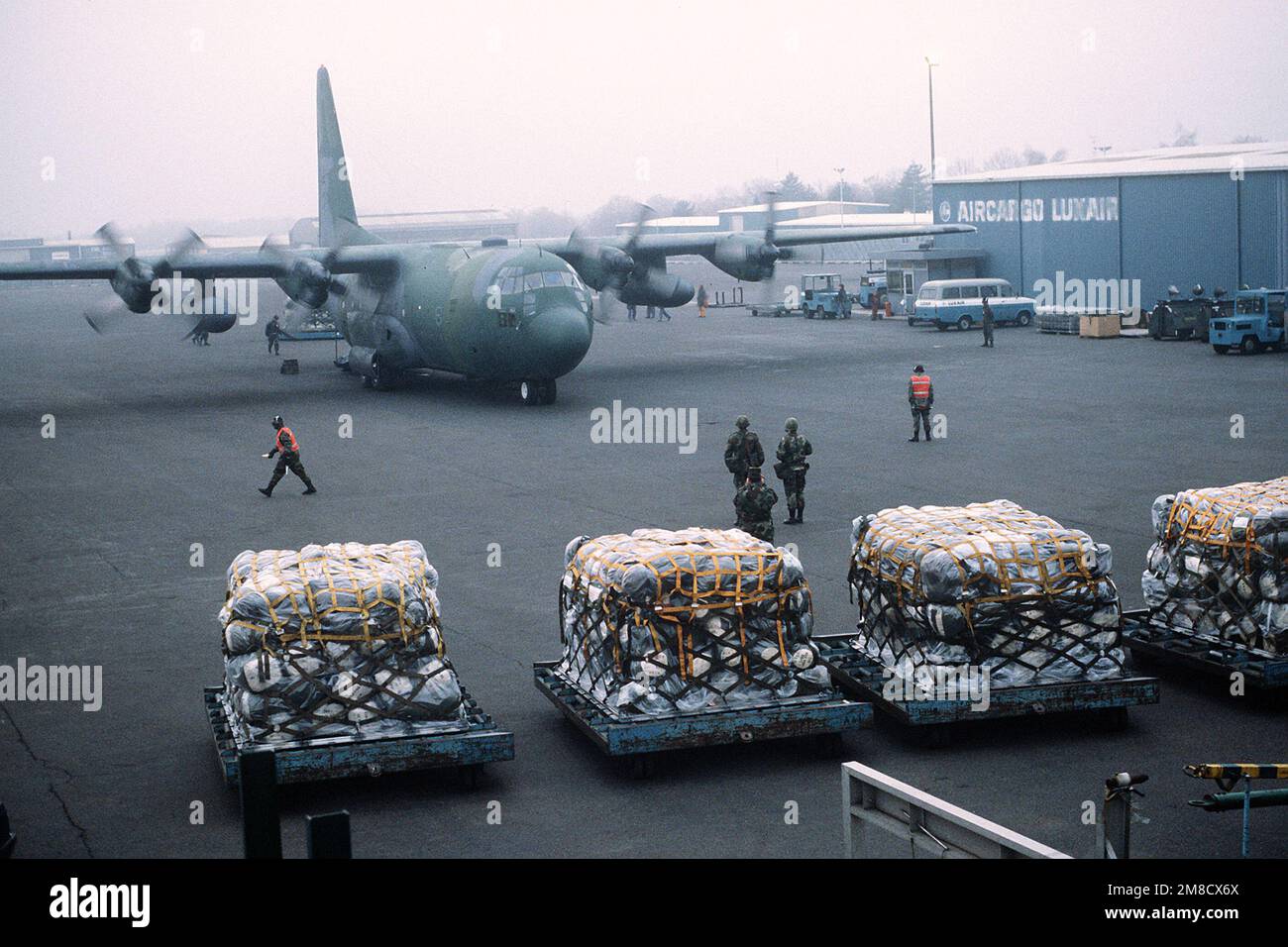 Pallets of cargo await loading aboard a 435th Tactical Airlift Wing C ...