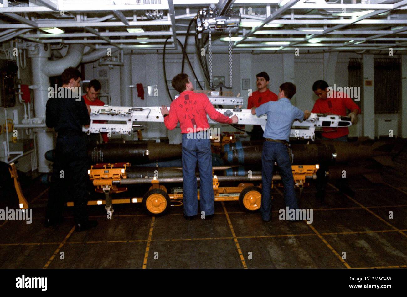 Weapons technicians aboard the nuclear-powered aircraft carrier USS ...