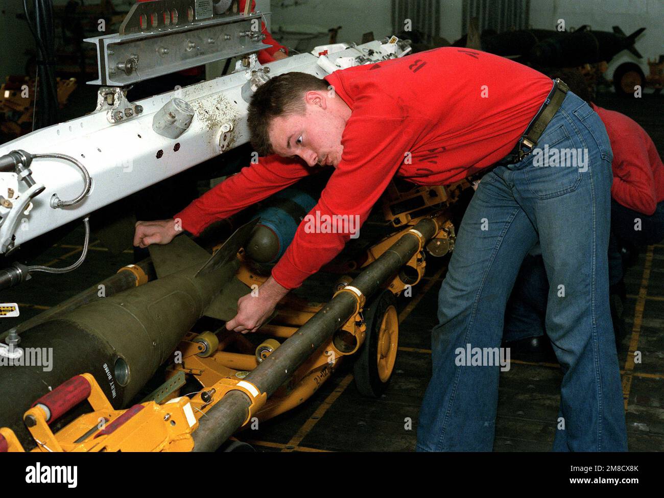 A weapons technician aboard the nuclear-powered aircraft carrier USS ...