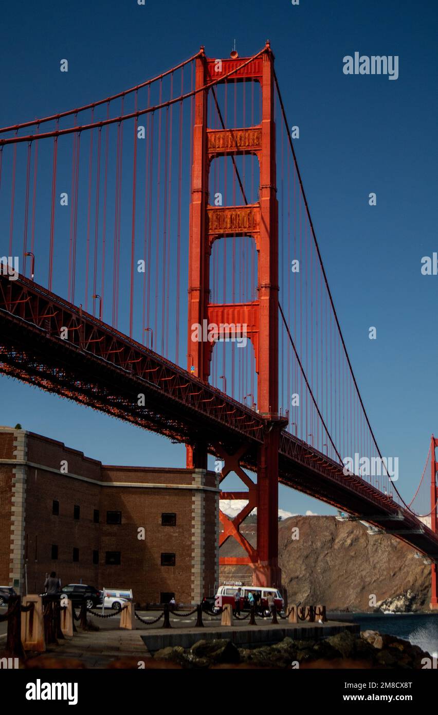 A vertical shot of the Golden Gate Bridge in San Francisco on a sunny ...