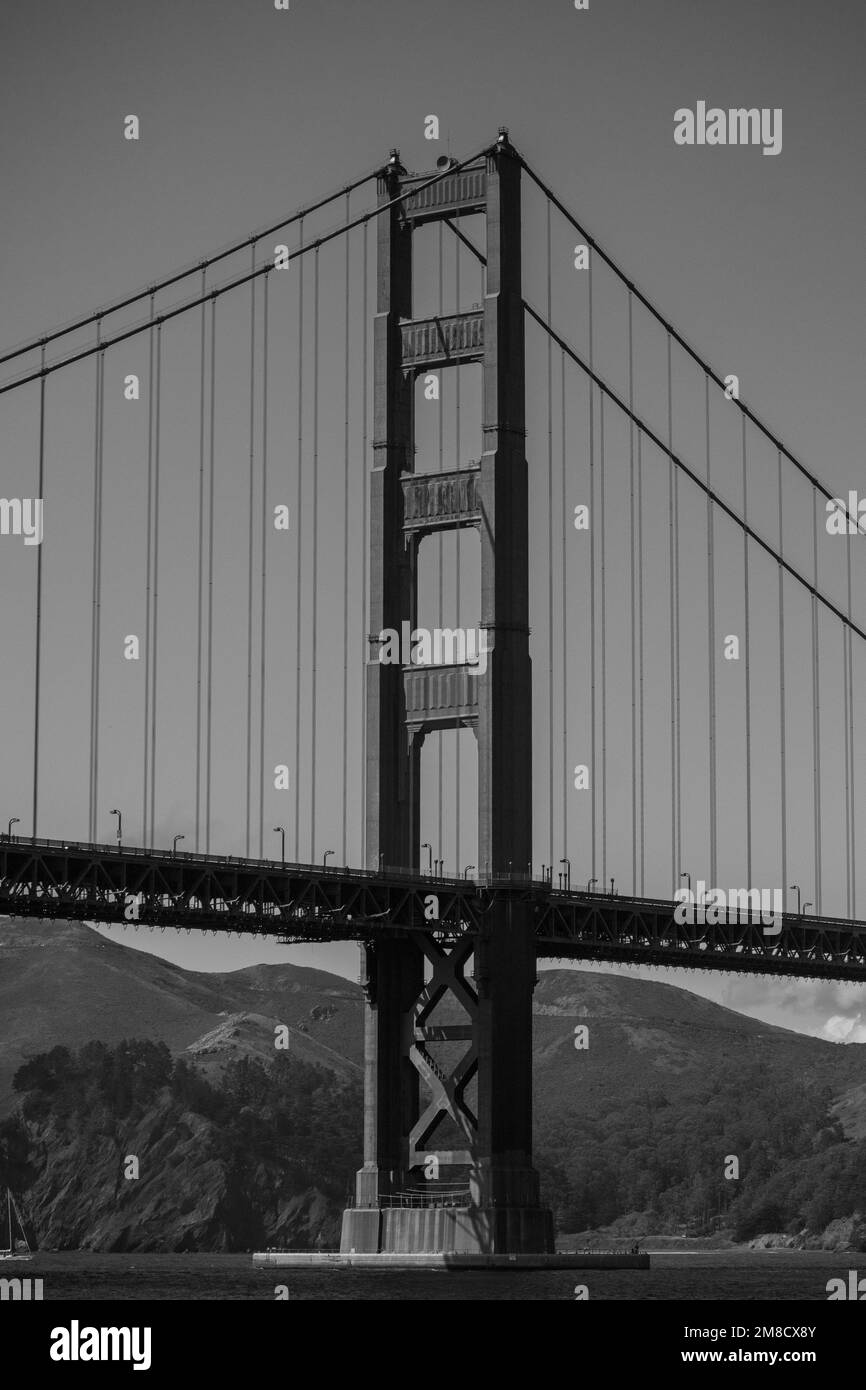 A vertical shot of the Golden Gate Bridge in San Francisco in Black and ...