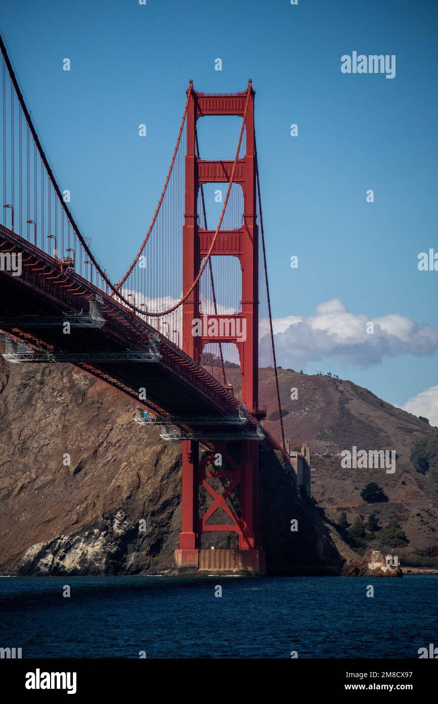 A vertical shot of the Golden Gate Bridge in San Francisco on a sunny ...