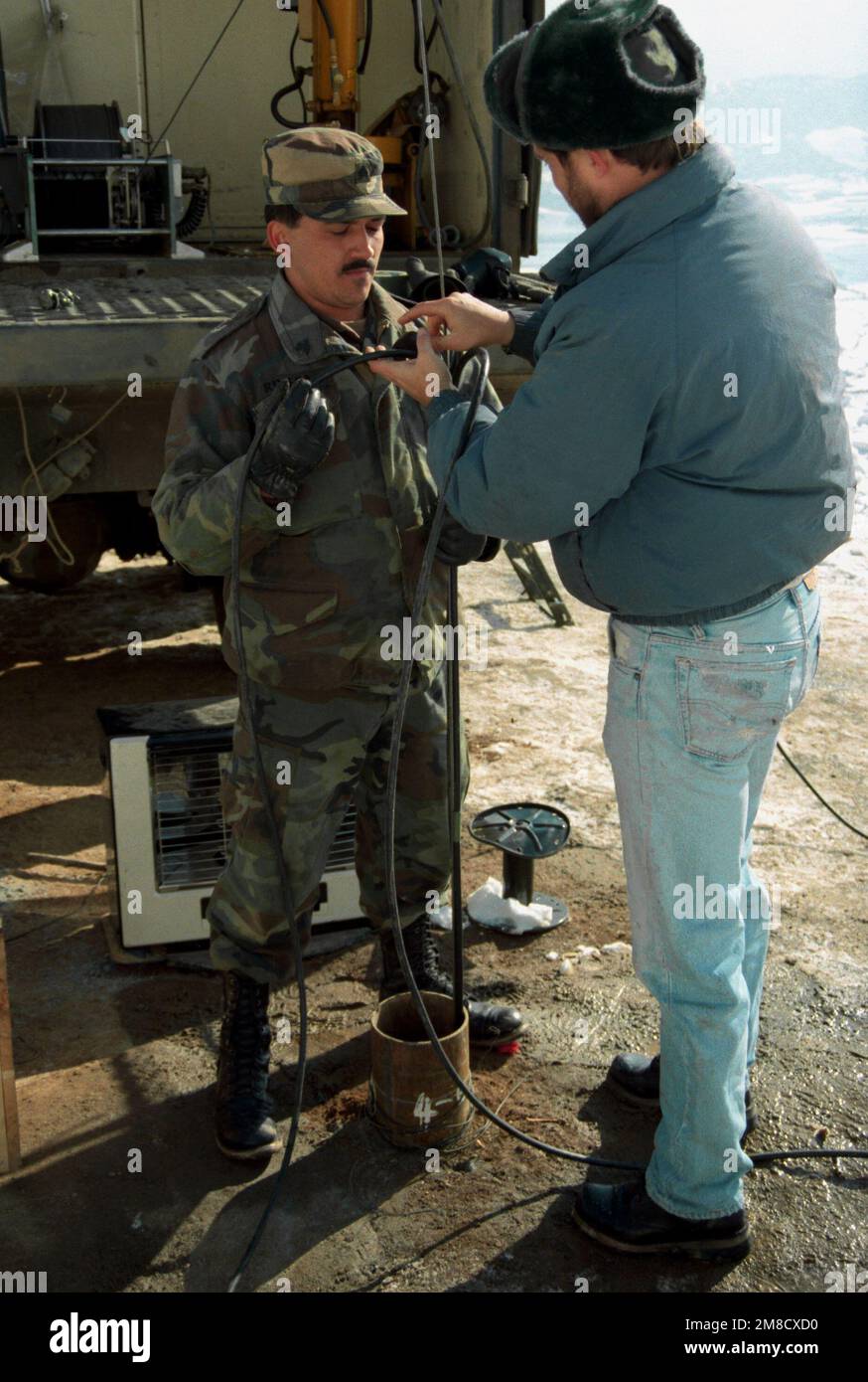 Members of an 8th U.S. Army surveillance team at a bore hole site near ...