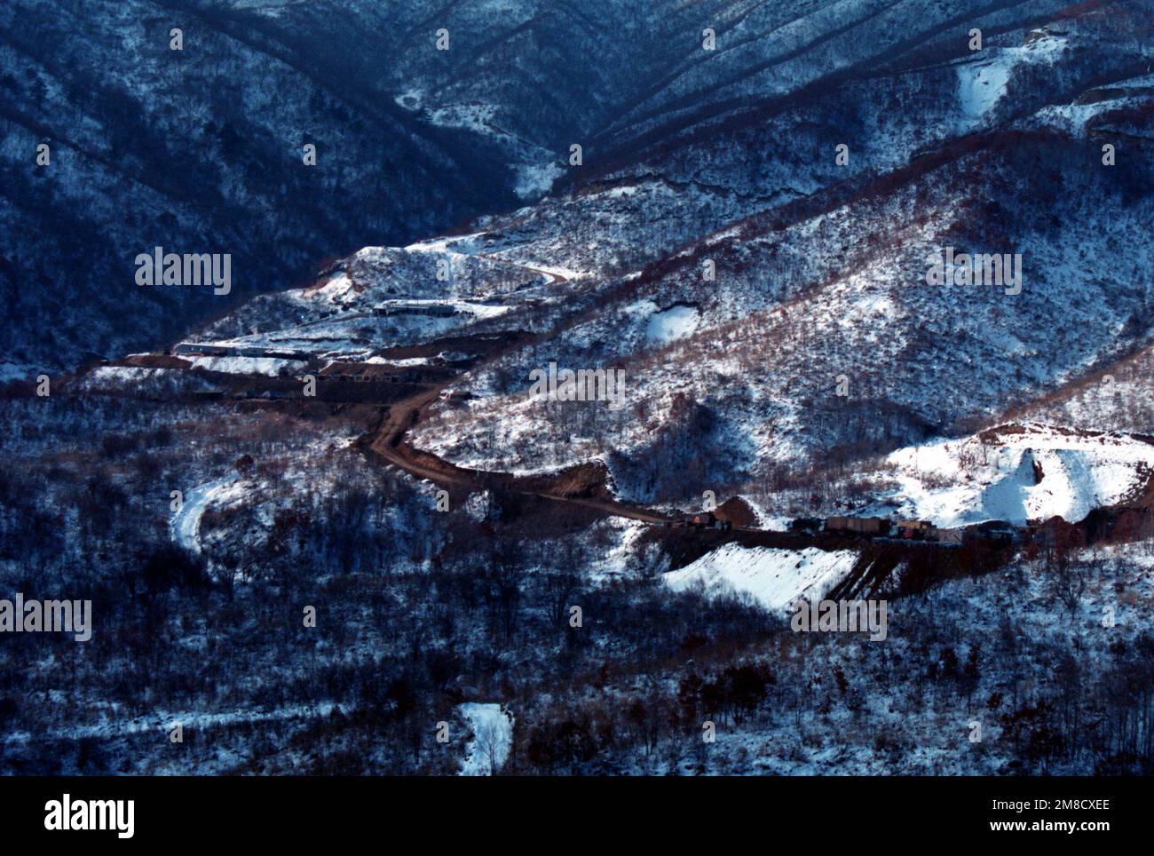 Construction equipment stands on the north rim of the Punch Bowl area ...