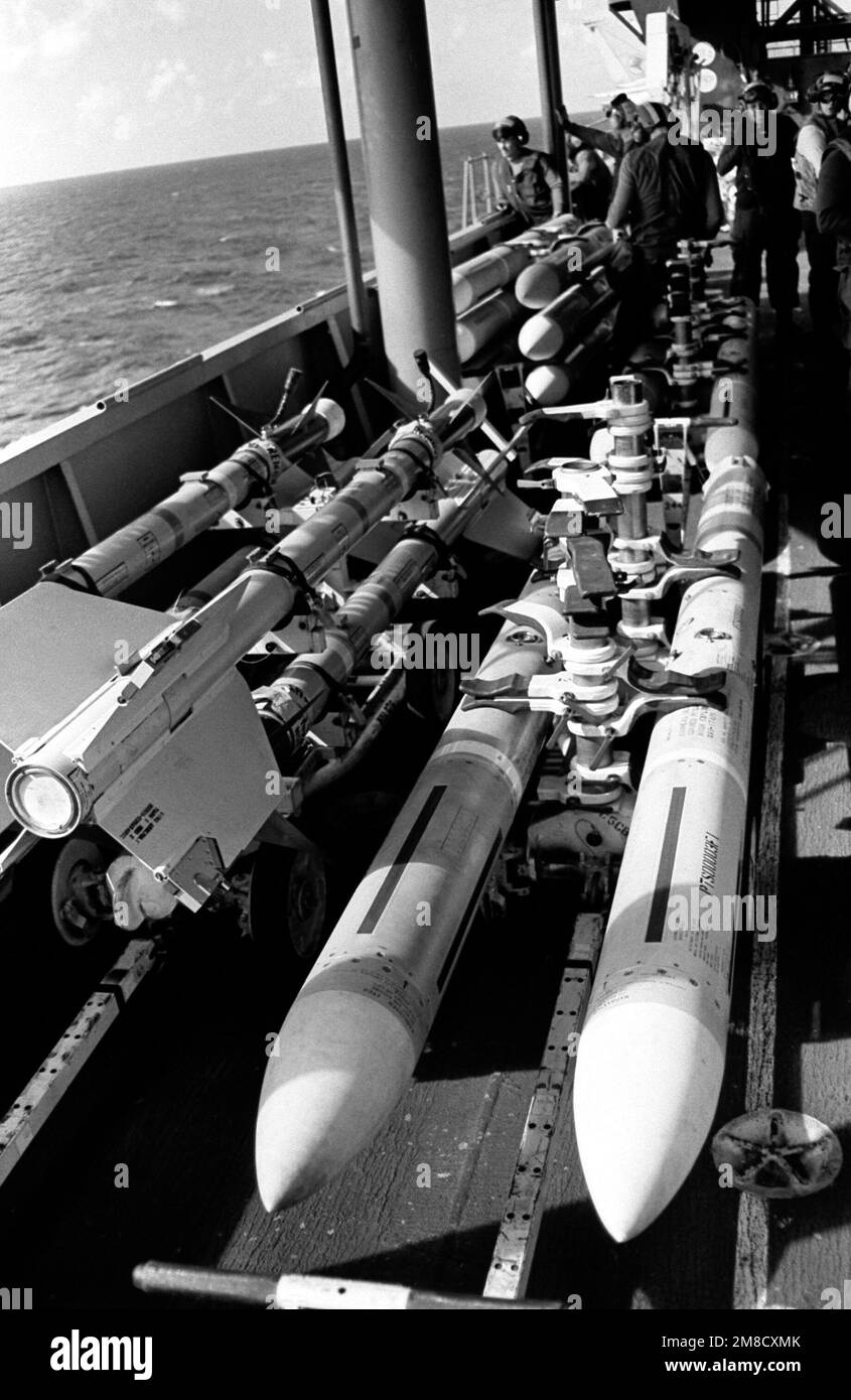 An AIM-9 Sidewinder missiles, left, and AIM-7 Sparrow missiles are ...