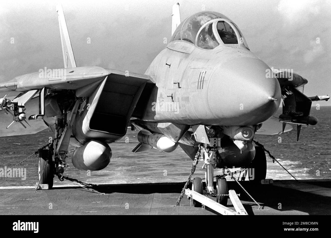 A Fighter Squadron 14 (VF-14) F-14A Tomcat aircraft sits armed and ...