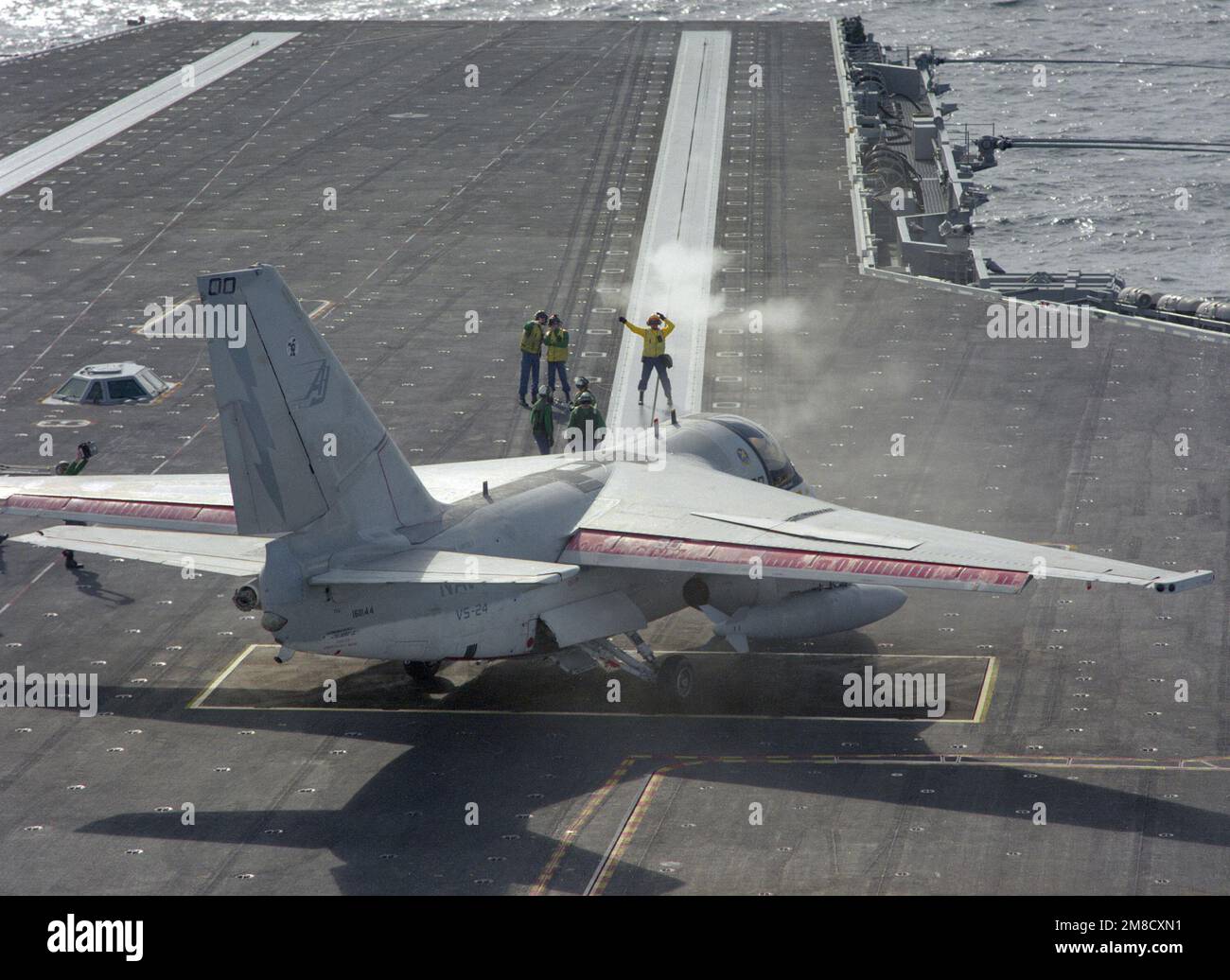 A catapult crewman directs an Air Anti-submarine Squadron 24 (VS-24) S ...
