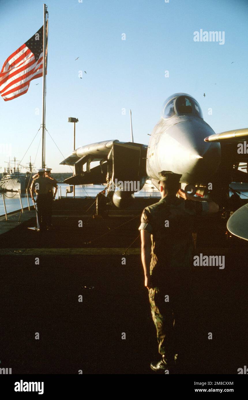 Lance Corporal Futo salutes as his fellow Marines, Lance Corporal ...