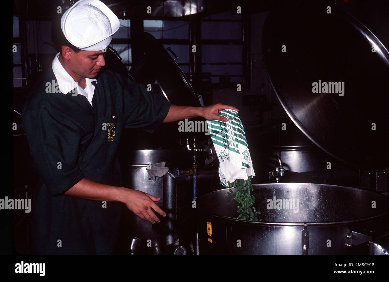 Mess Management SPECIALIST 3rd Class Roger Ejanda prepares green beans ...