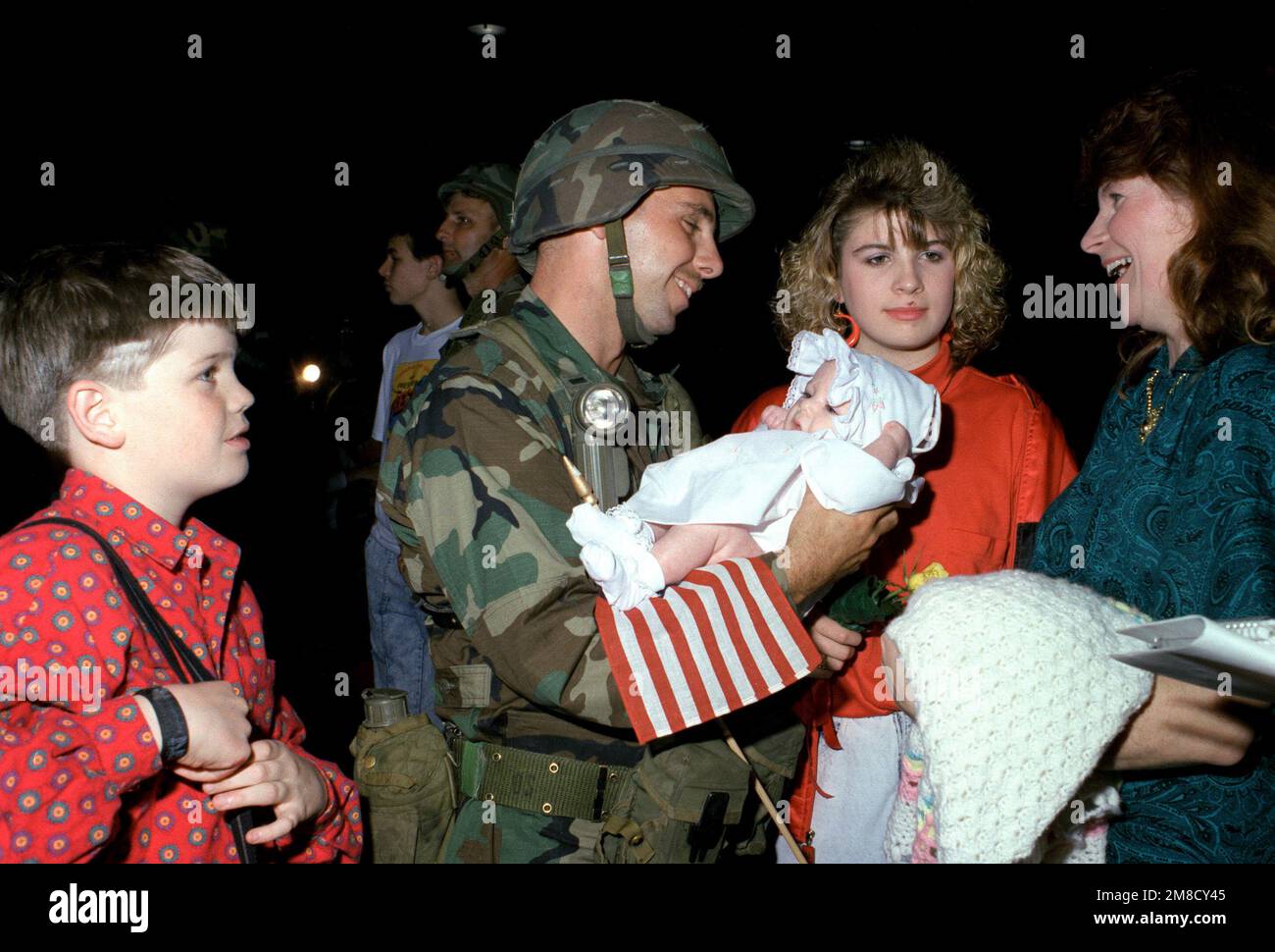 First Lieutenant Roberts of the 6th Infantry Regiment holds his dauther ...