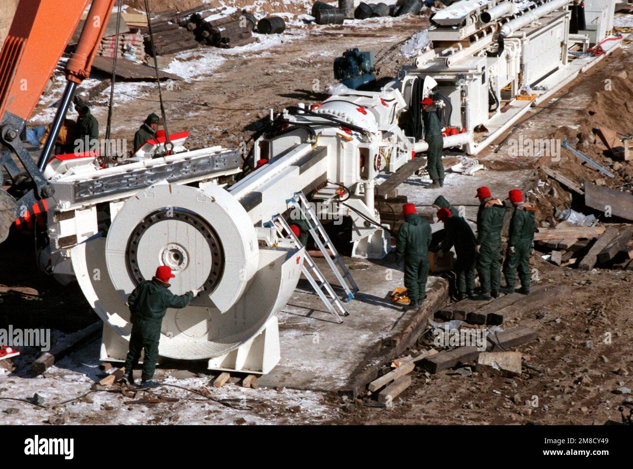 Engineers assemble tunnel boring equipment near Kach'il-Bong Peak, the ...