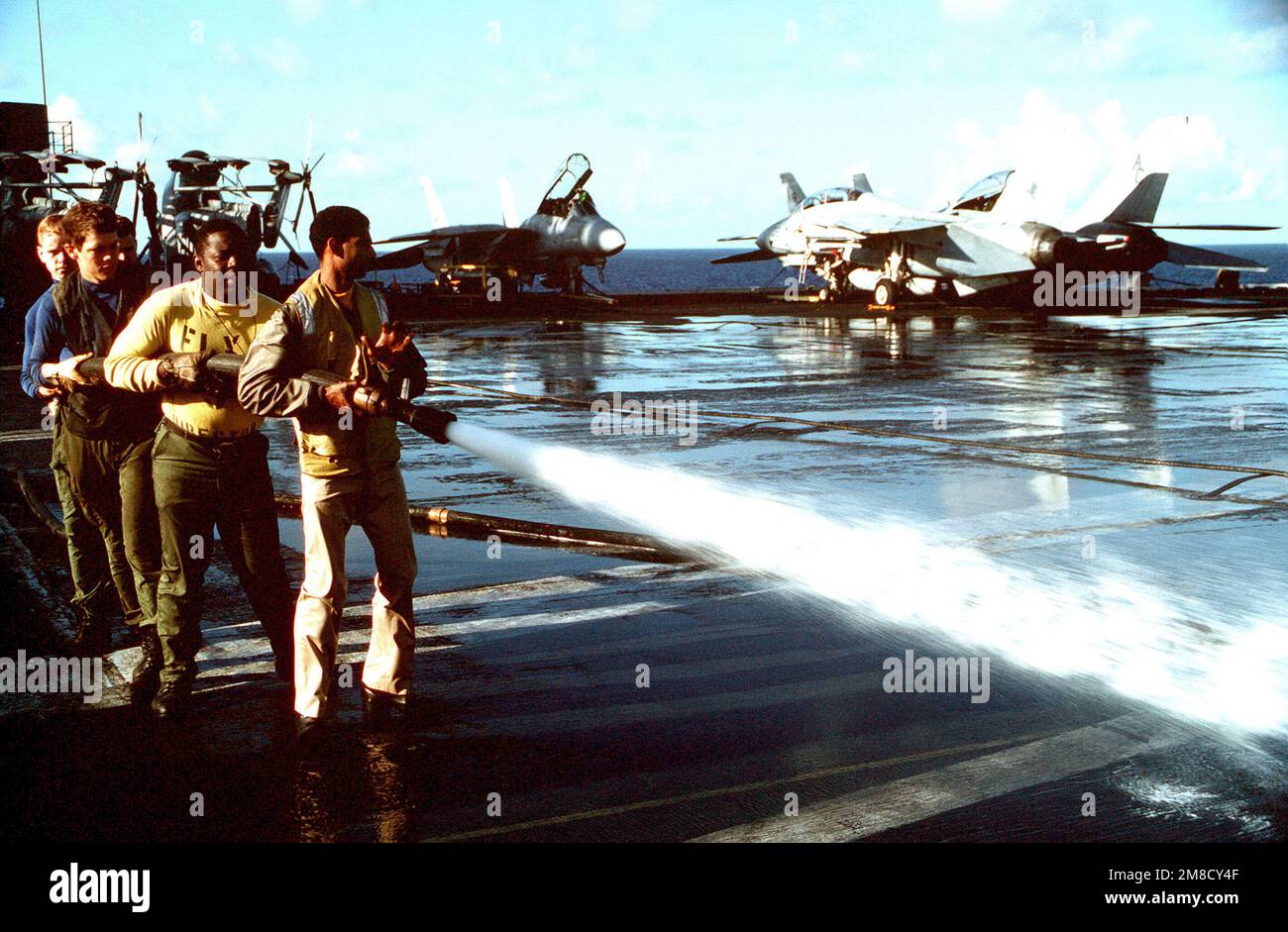 Crewmen hose down flight hi-res stock photography and images - Alamy