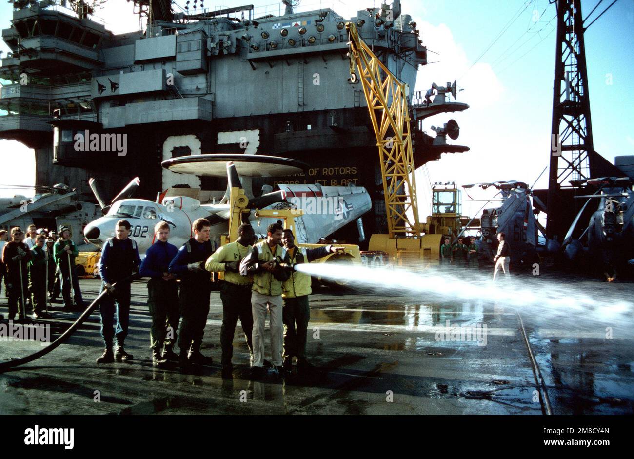 Crewmen hose down flight hi-res stock photography and images - Alamy