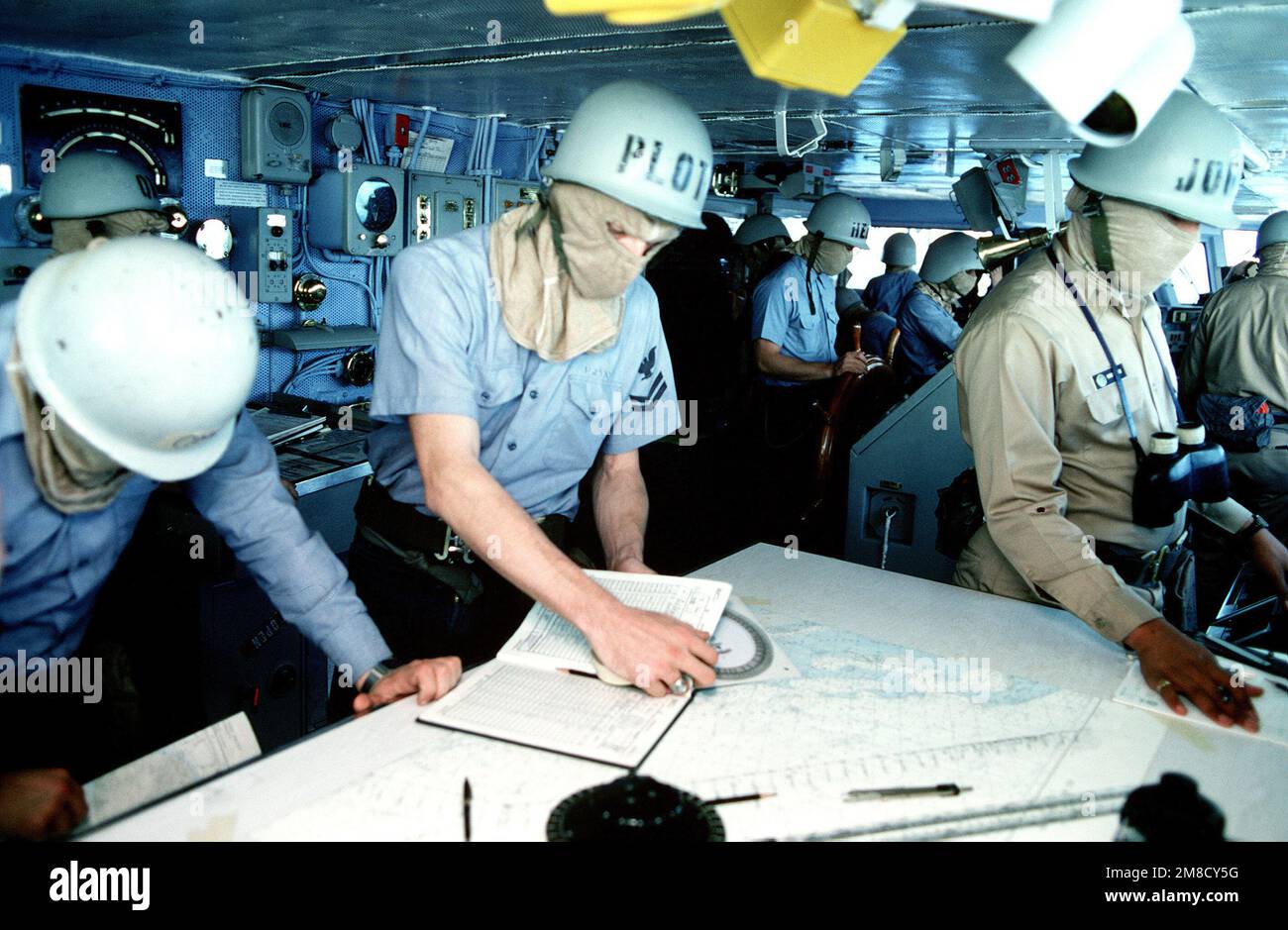 Officers and crewmen on the bridge of the aircraft carrier USS JOHN F ...