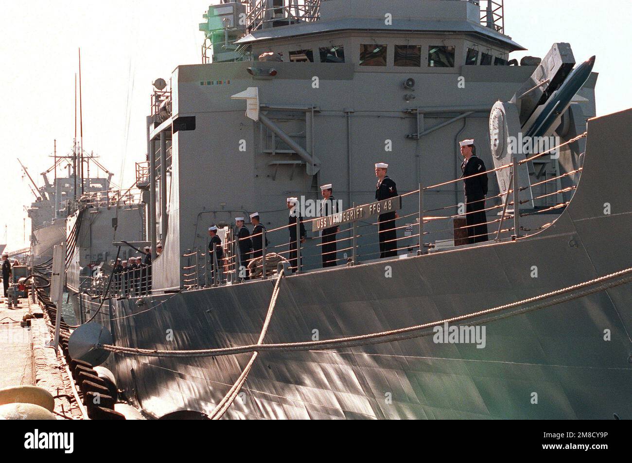 Sailors man the rail aboard the guided missile frigate USS VANDEGRIFT ...