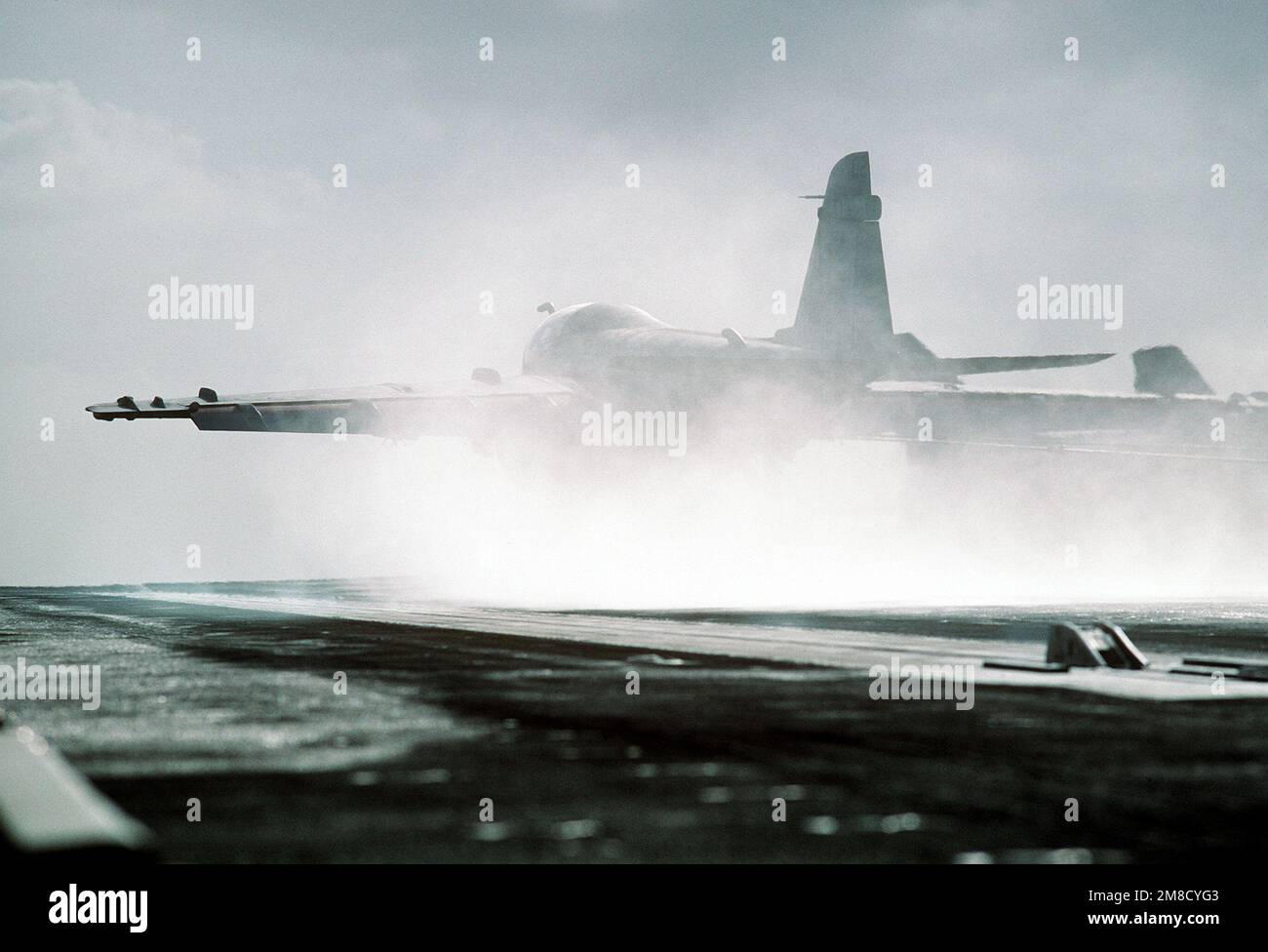 Steam rises from the catapult as an Attack Squadron 75 (VA-75) A-6E ...