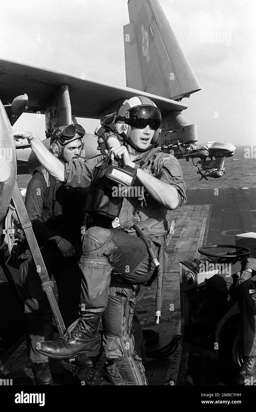 LTJG Naugton climbs to the cockpit of his Attack Squadron 72 (VA-72) A ...