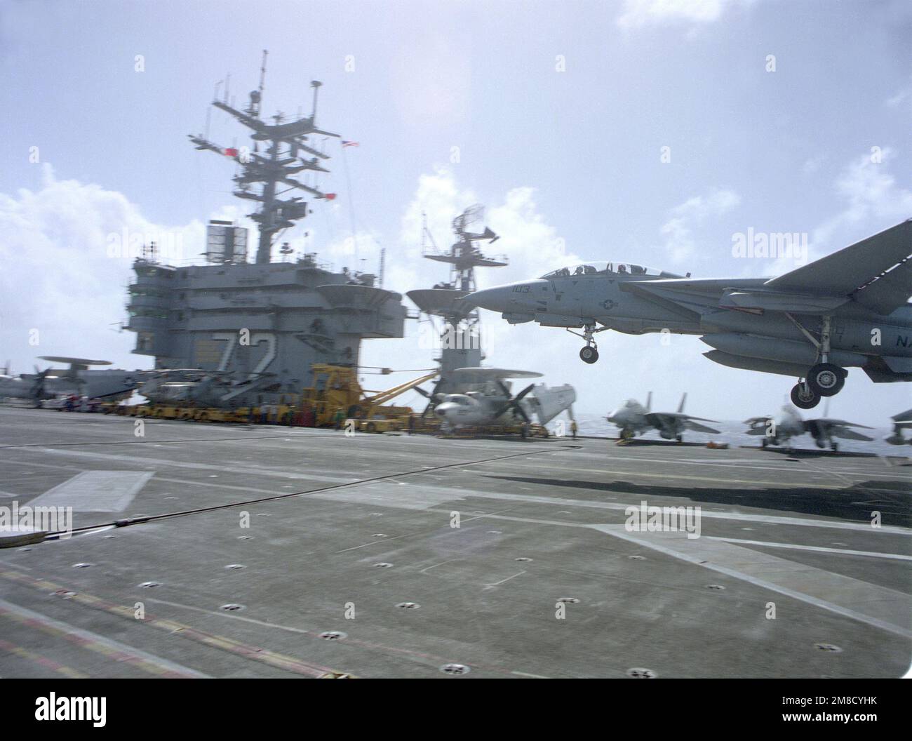 A Fighter Squadron 84 (VF-84) F-14A Tomcat aircraft descends to the ...