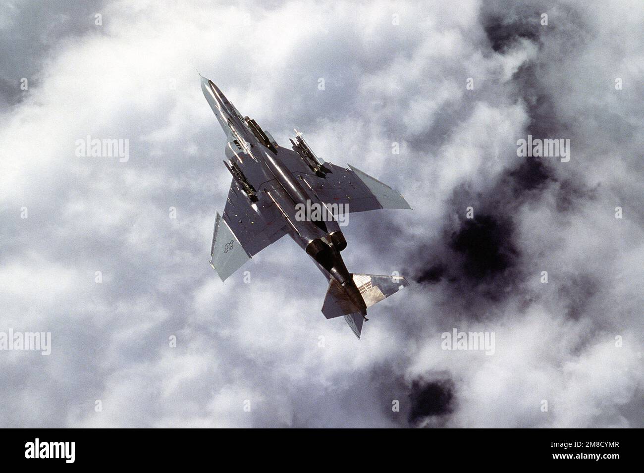 An air-to-air underside view of a 335th Tactical Fighter Squadron F-4E ...