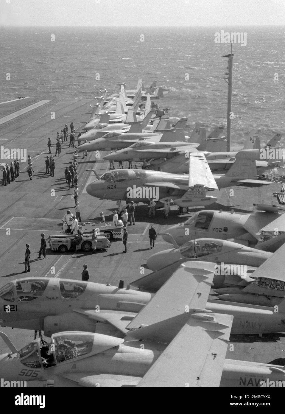 Aircraft line the starboard edge of the flight deck aboard the aircraft ...