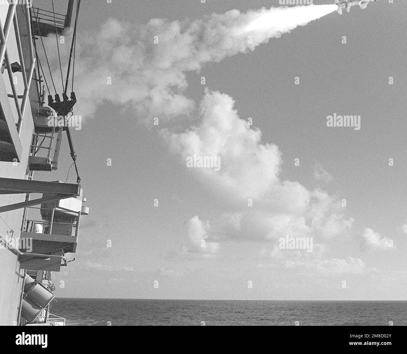 An RGM-84A Harpoon anti-ship missile is launched from the destroyer USS ...